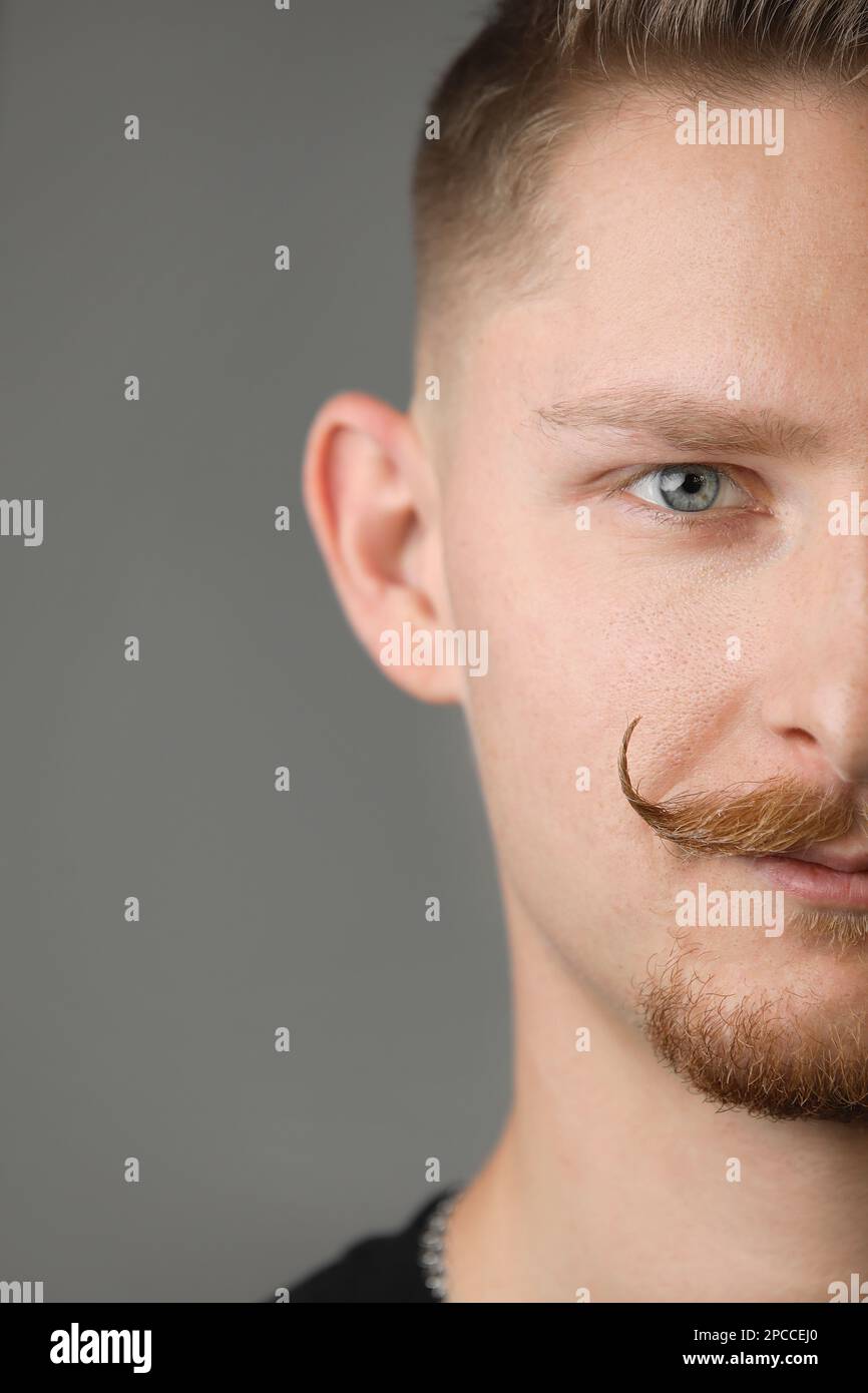 Half portrait stylish young handsome bearded man with 'handlebar ...