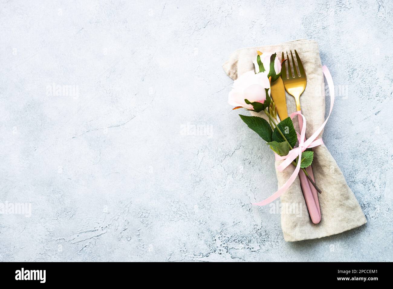Spring Table setting with modern cutlery and rose flowers Stock Photo ...