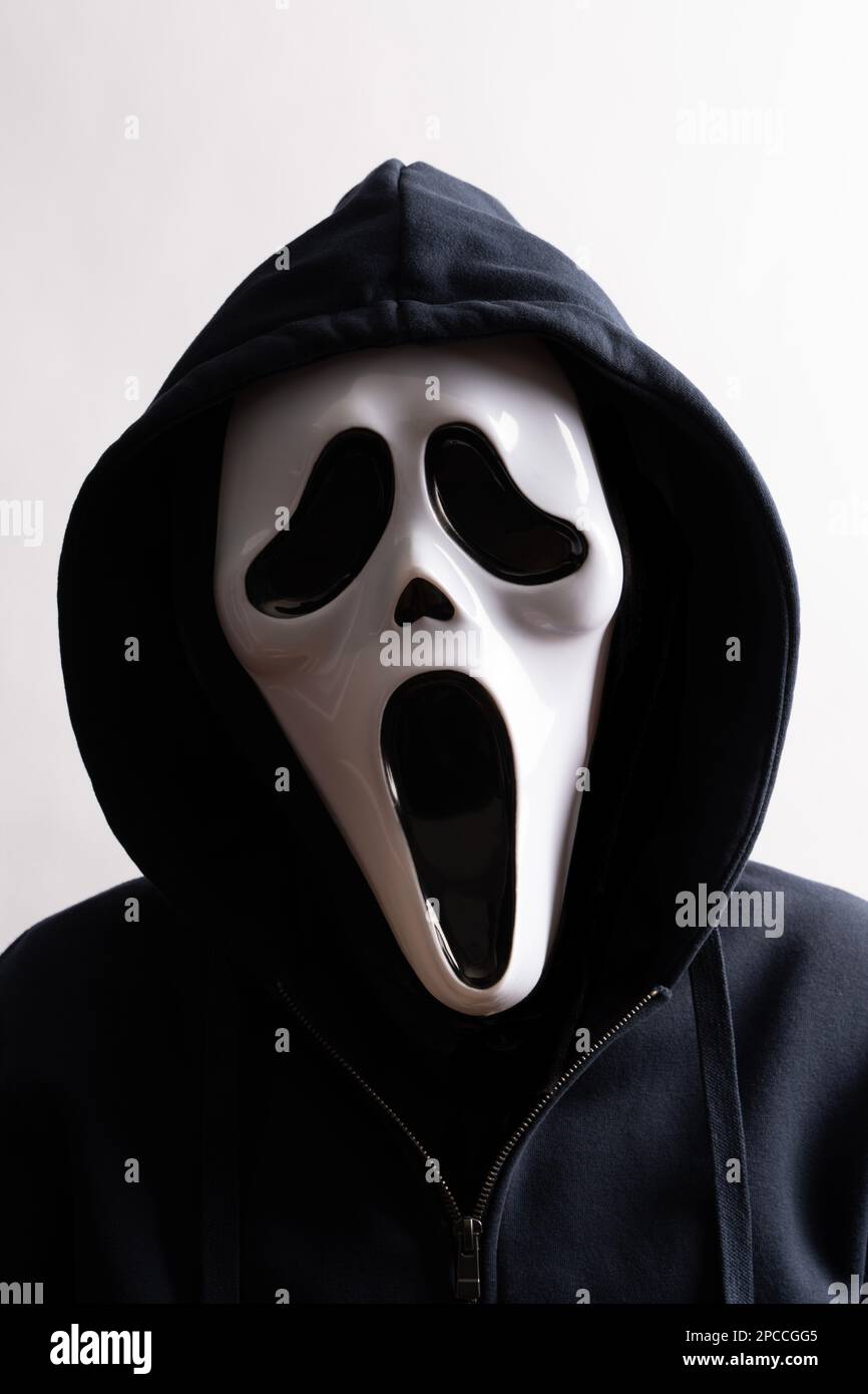 Packshot of Mask. An anonymous man with a white mask and a hood on the ...