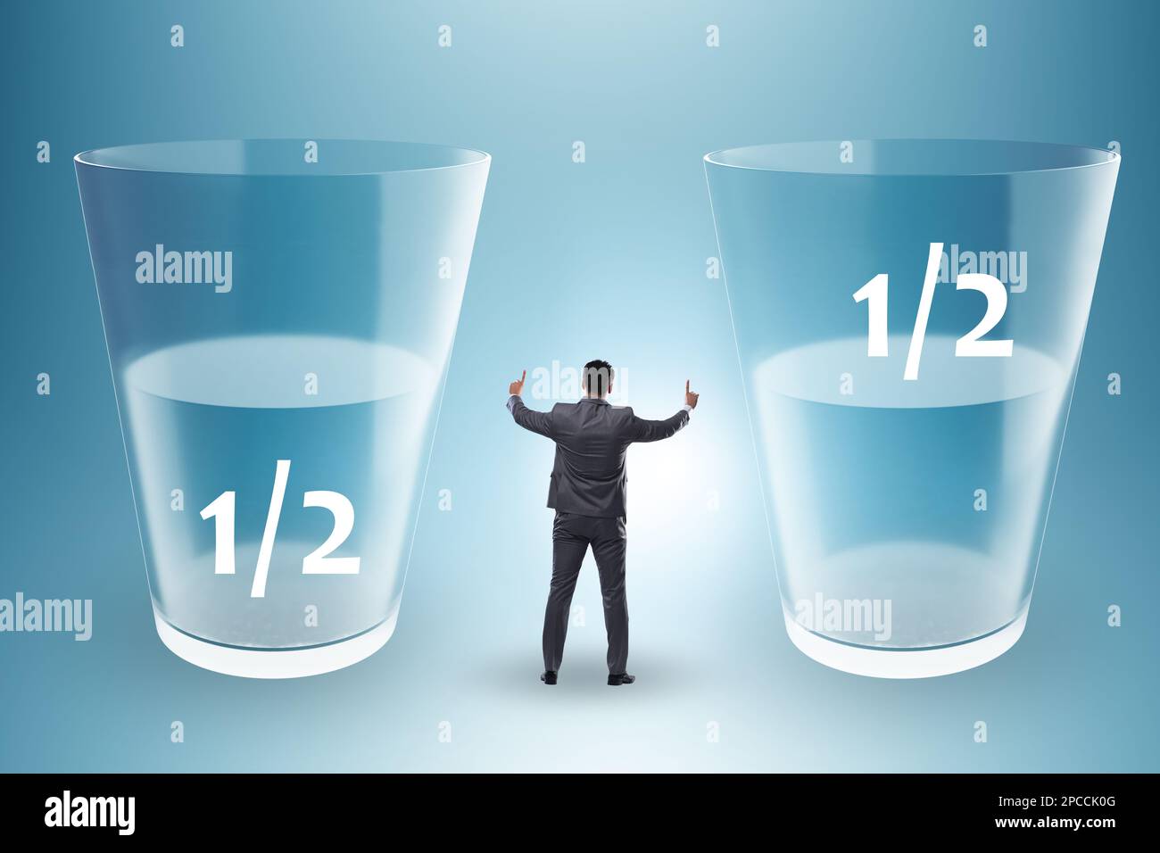 Businessman in the half empty half full glass concept Stock Photo - Alamy