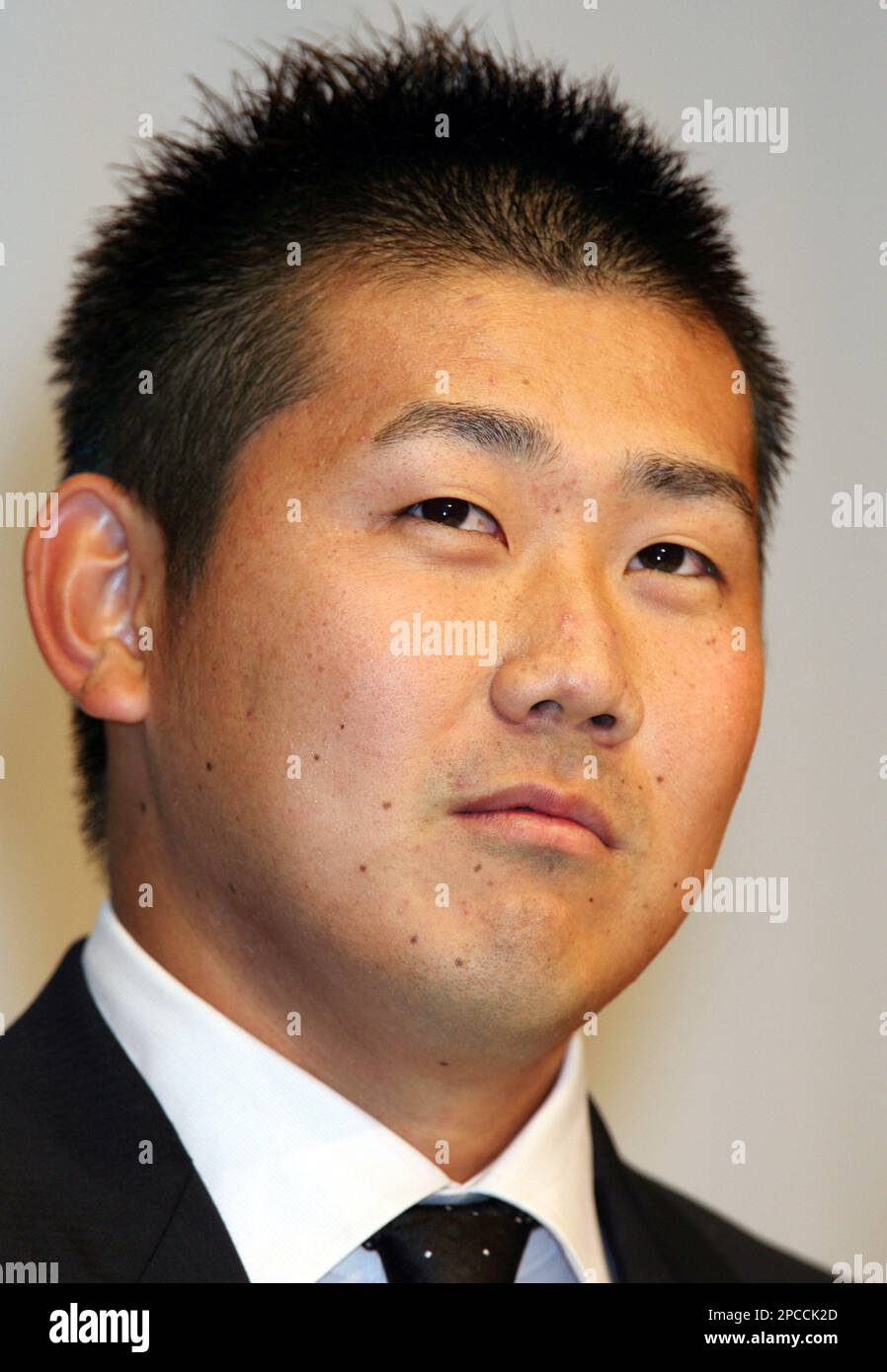 Japanese star pitcher Daisuke Matsuzaka of Seibu Lions ponders during a ...