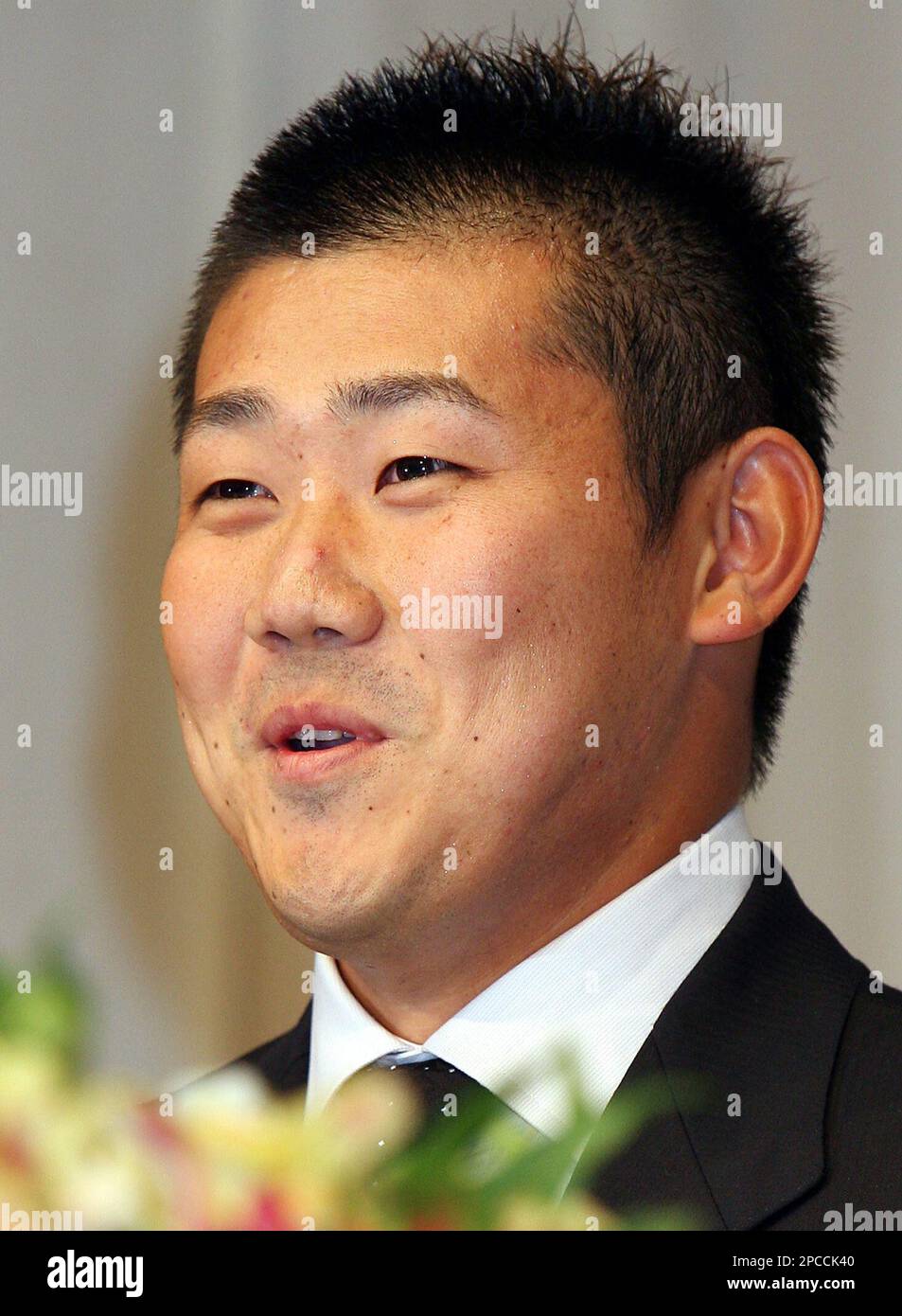 Japanese star pitcher Daisuke Matsuzaka of Seibu Lions smiles during a ...