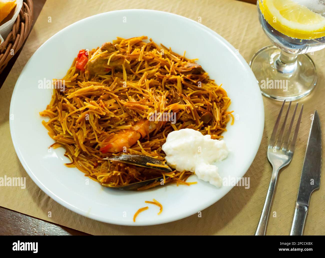 Paella with fideua, pasta noodles and seafood Stock Photo - Alamy