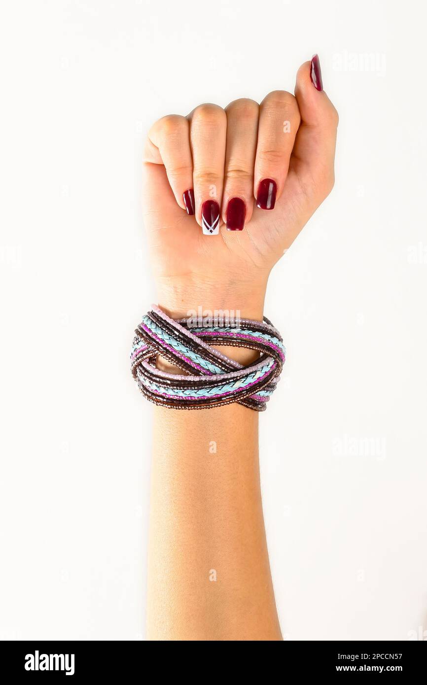 hands of a young woman showing painted nails, white background Stock ...