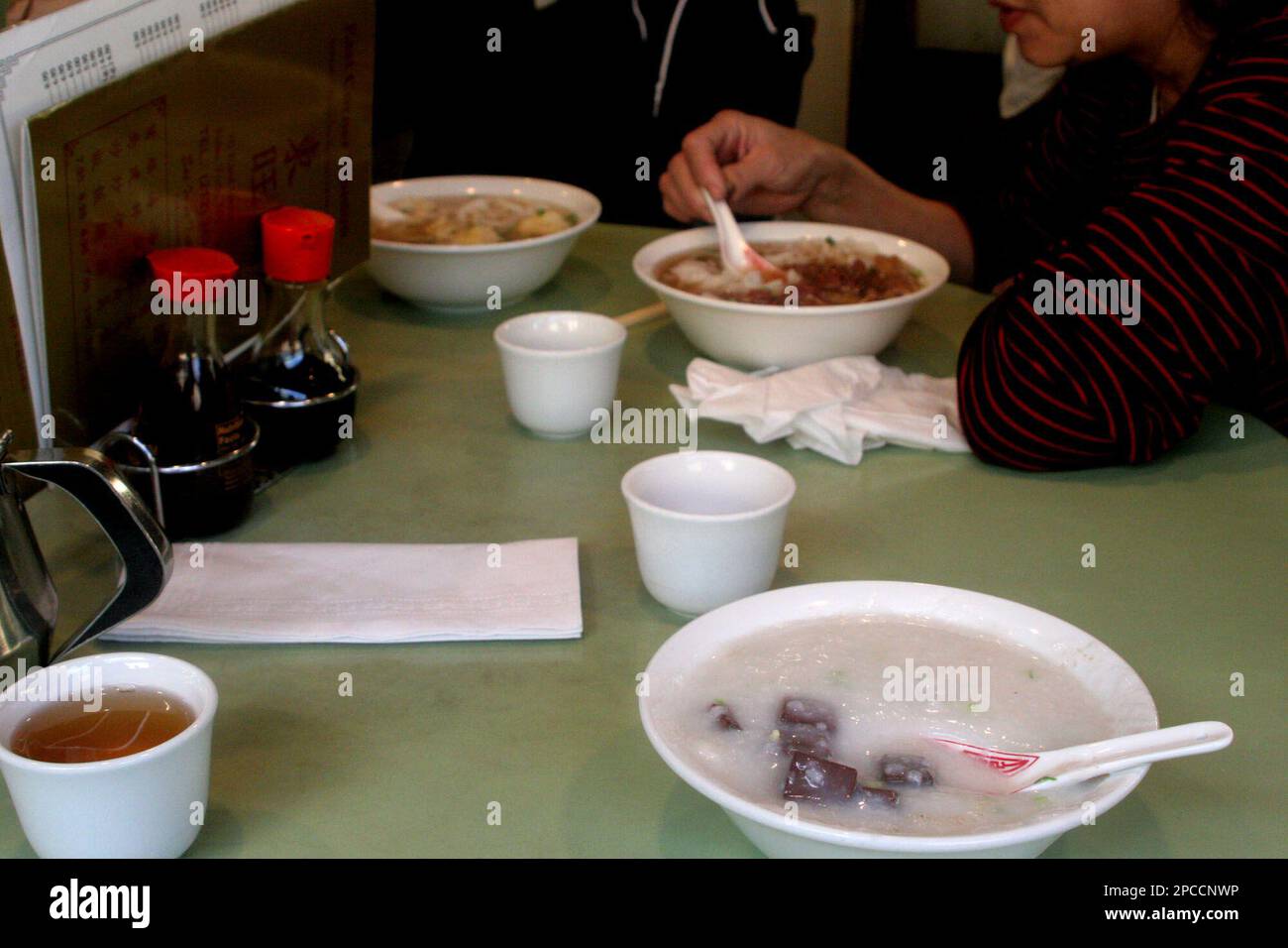 The reddish-brown cubes are called blood tofu in China. (AP Photo/Howie ...
