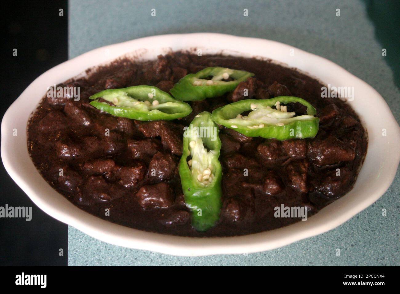 Don't be fooled by its cutesy nickname, chocolate pudding. Dinuguan is ...