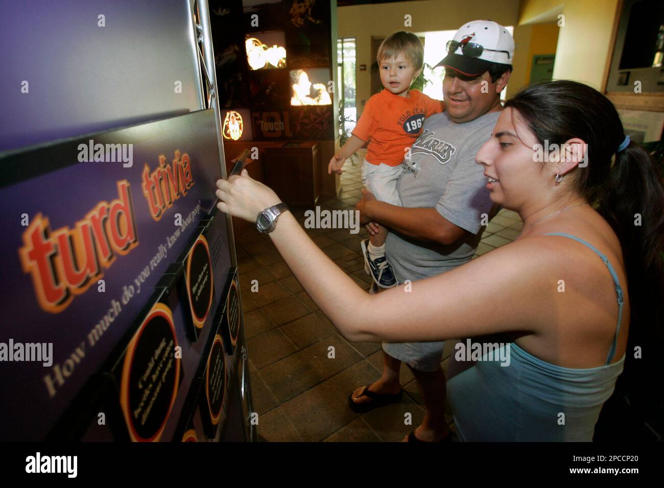 ** FILE ** Stephanie Rey, right, tests her skill at "turd trivia" as ...