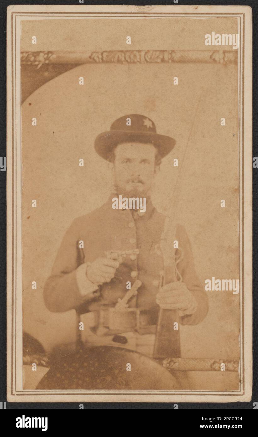 Unidentified soldier in Confederate uniform with knife, revolver, and ...