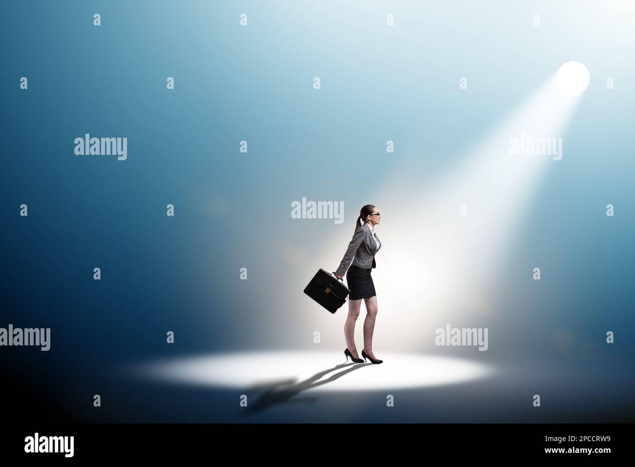 Business people under the spotlight concept Stock Photo - Alamy