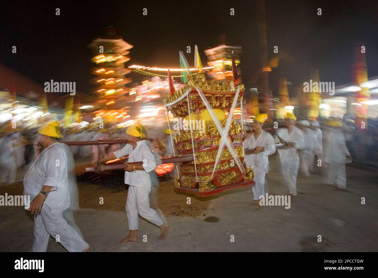 Malaysian Chinese carrying an Emperor God prepare to walk barefoot over ...