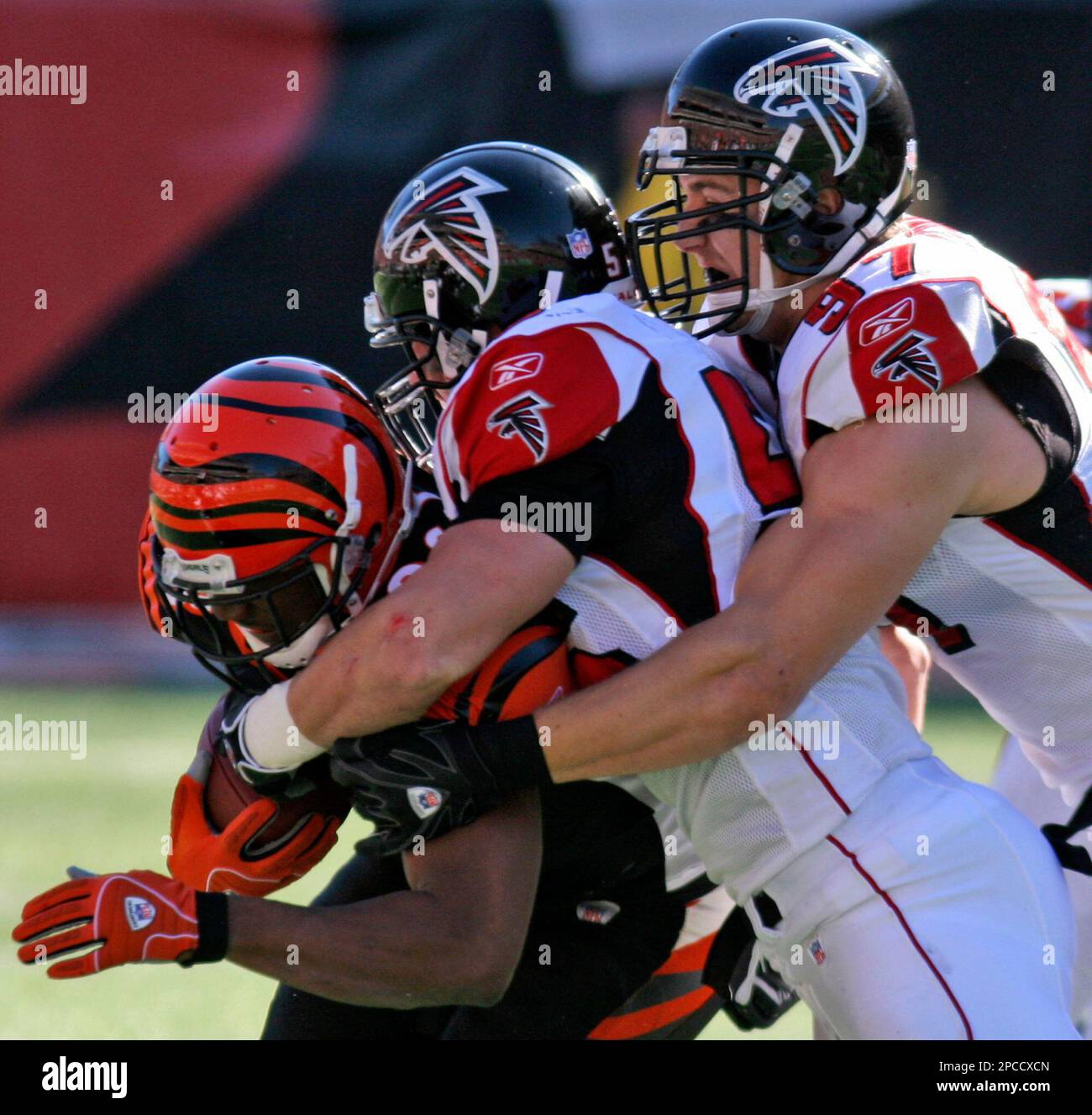 Cincinnati Bengals running back Chris Perry, left, is tackled by ...