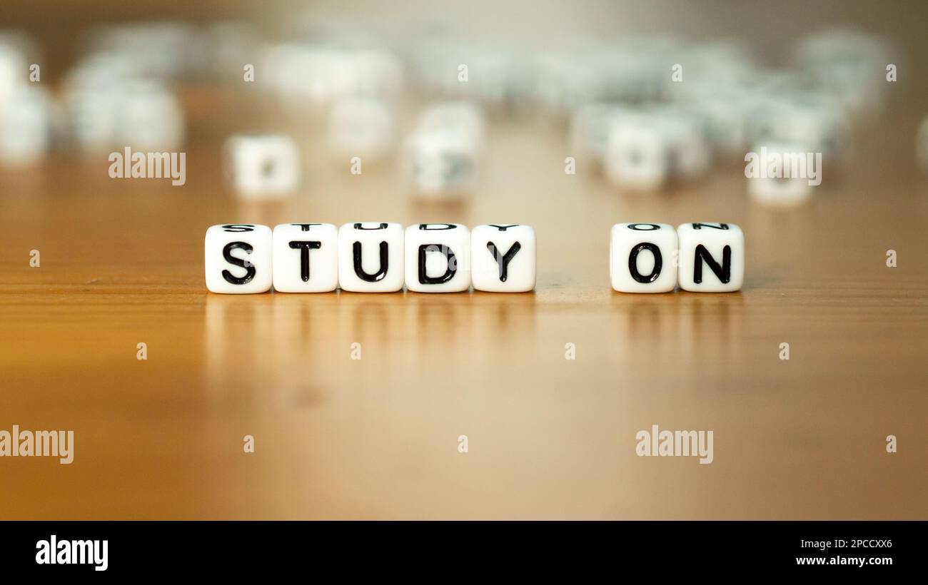 Study on slogan in white block letter beads Stock Photo - Alamy