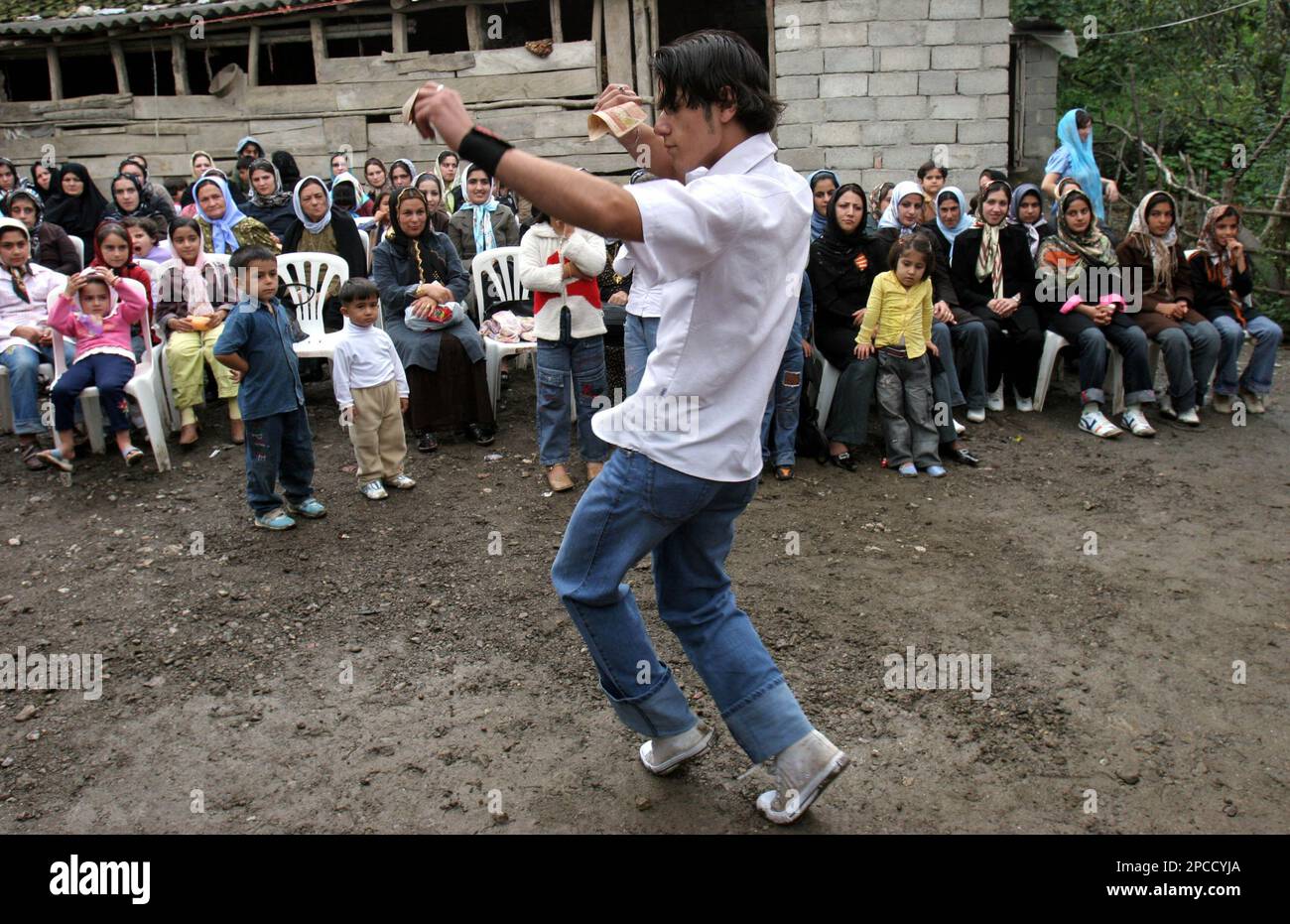 A young Iranian man dances at a wedding party during Eid al-Fitr ...