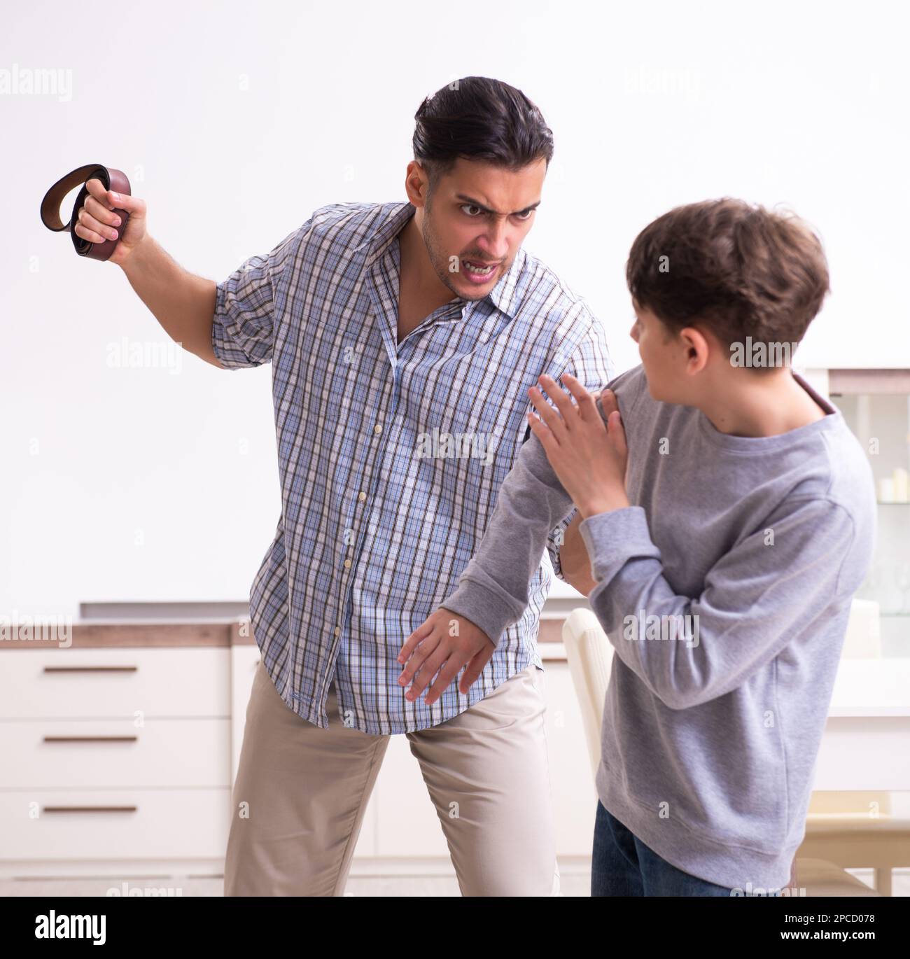 The father beating and punishing his sone Stock Photo - Alamy