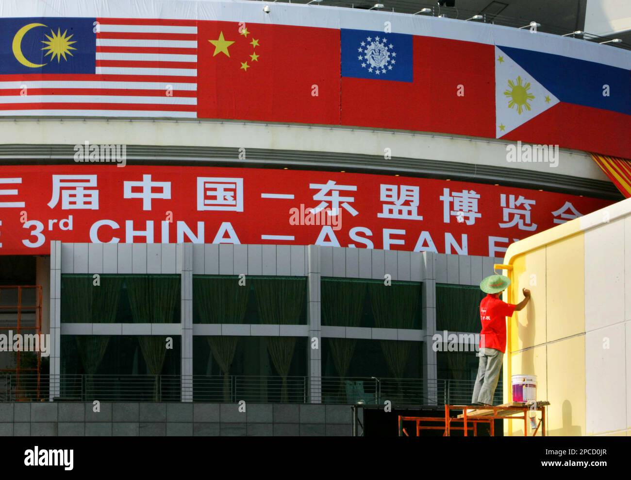 A Chinese worker sets up a booth at the China-ASEAN (Association of ...