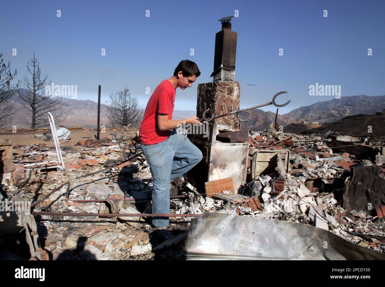 Shane Affsa salvages a coat tree made of horseshoes from the home of ...