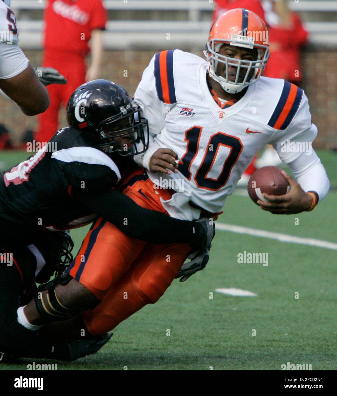Syracuse quarterback Perry Patterson (10) is sacked by Cincinnati ...