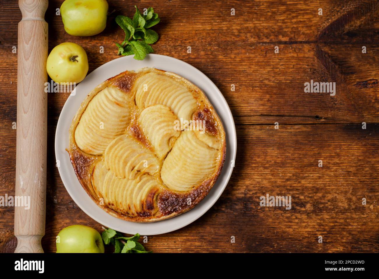 Cooked apple pie on wooden background. Finished semi-finished product ...