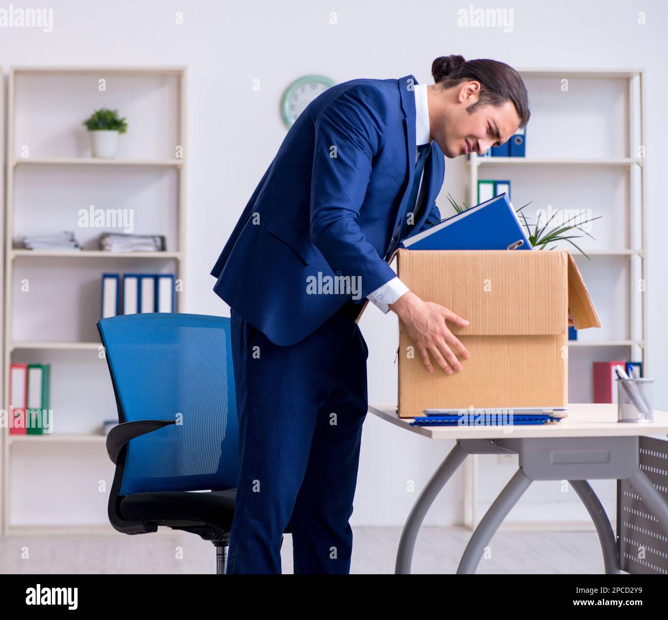 The young employee being made redundant Stock Photo - Alamy