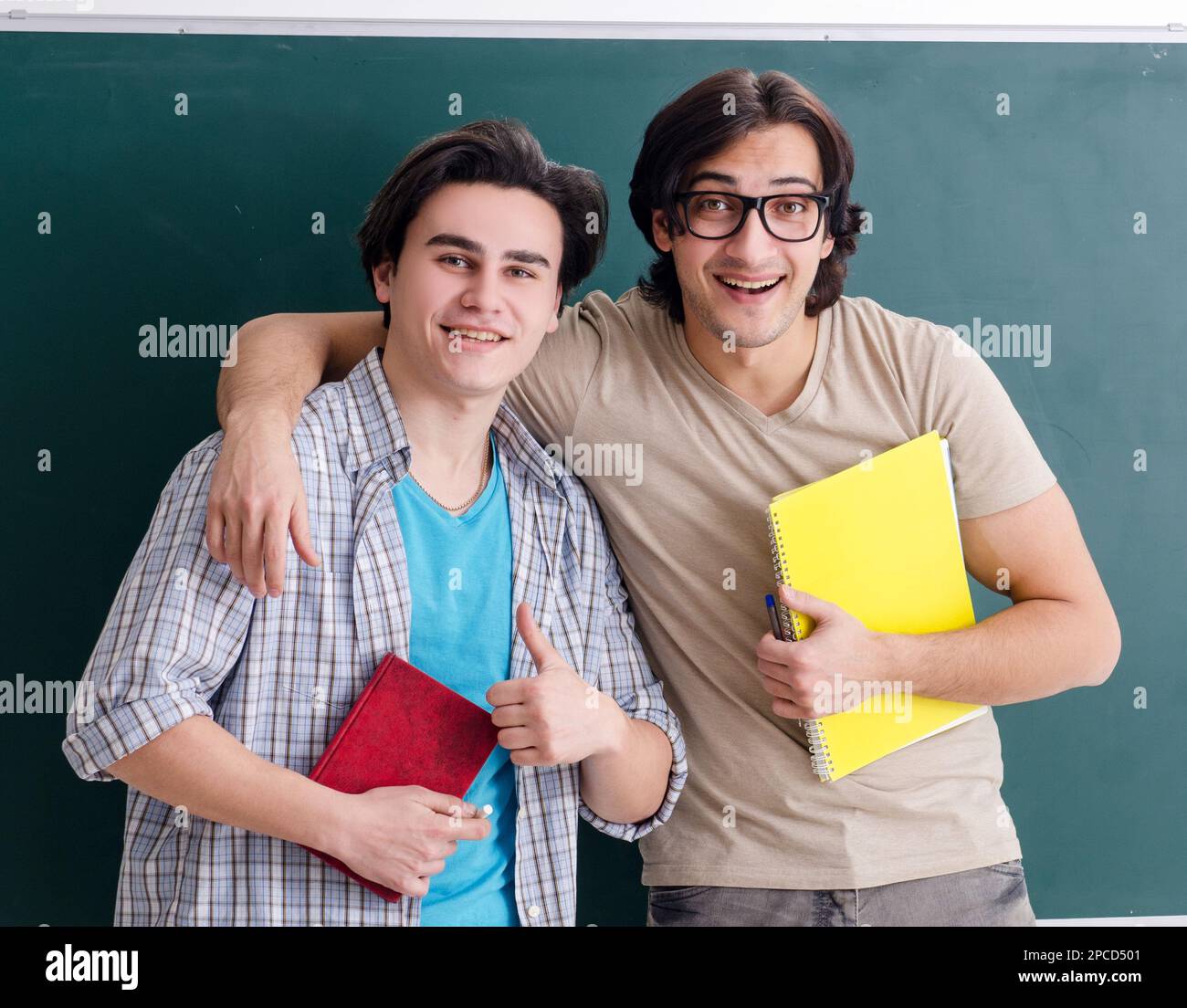 The two male students in the classroom Stock Photo - Alamy