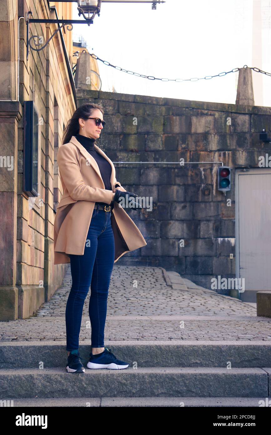 Woman standing on steps hi-res stock photography and images - Alamy
