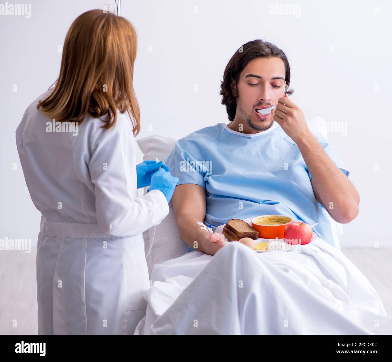 The male patient eating food in the hospital Stock Photo - Alamy