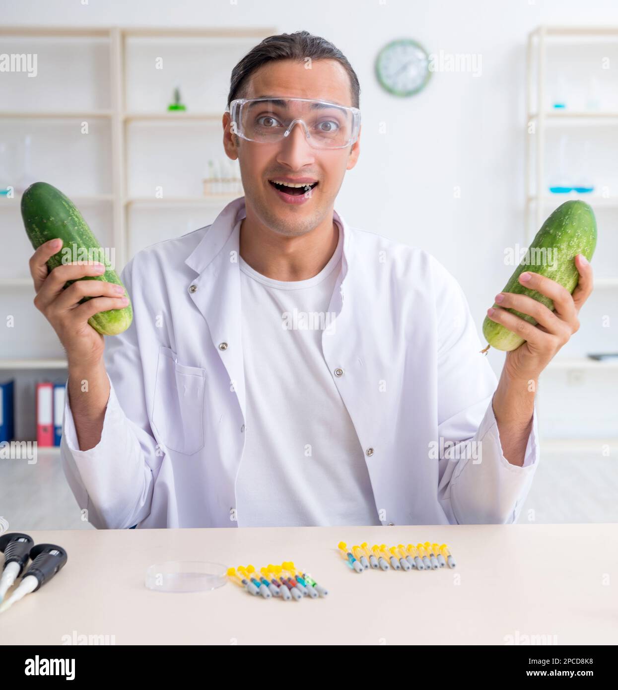 The male nutrition expert testing vegetables in lab Stock Photo - Alamy