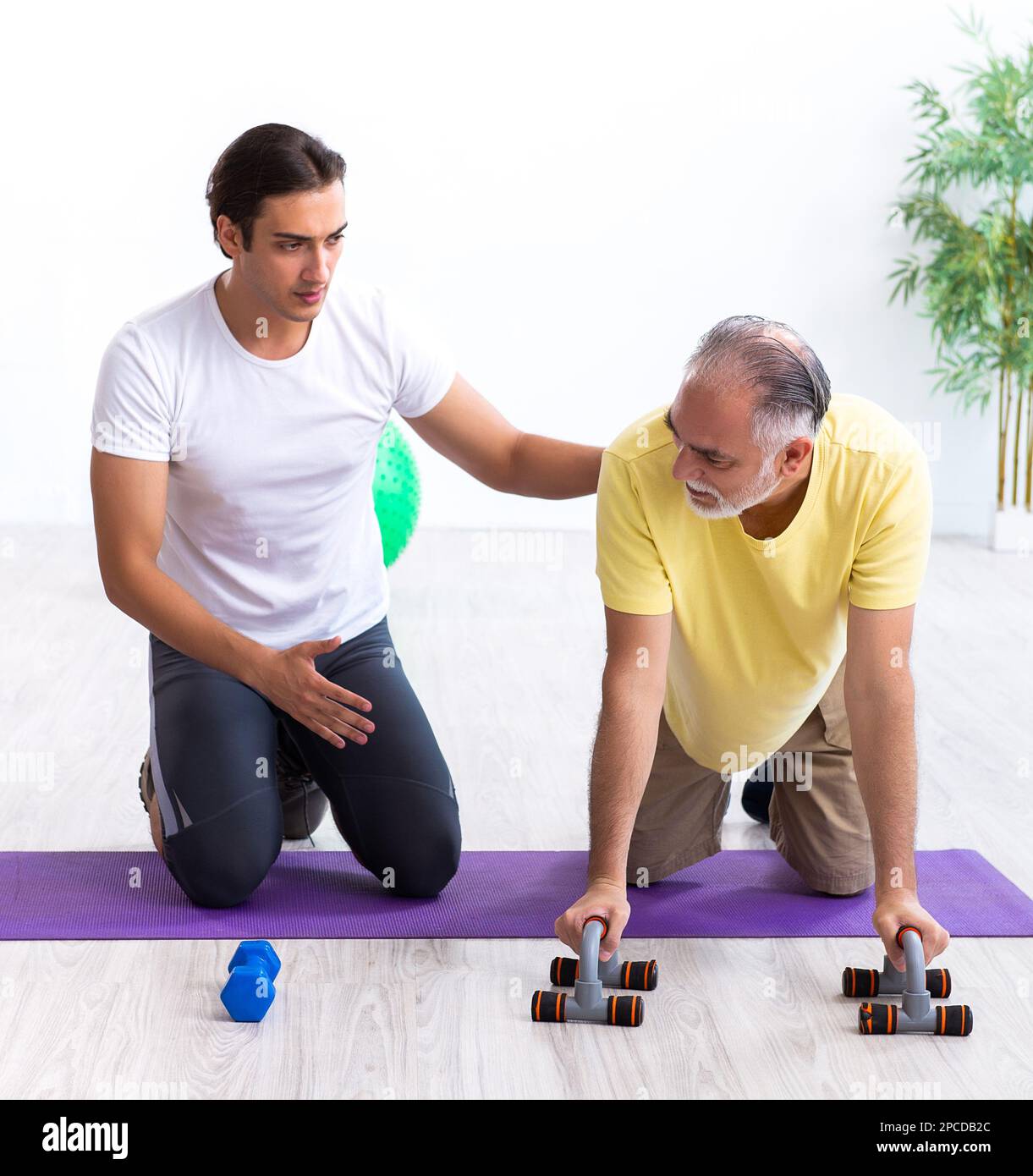 The old man doing exercises indoors Stock Photo - Alamy