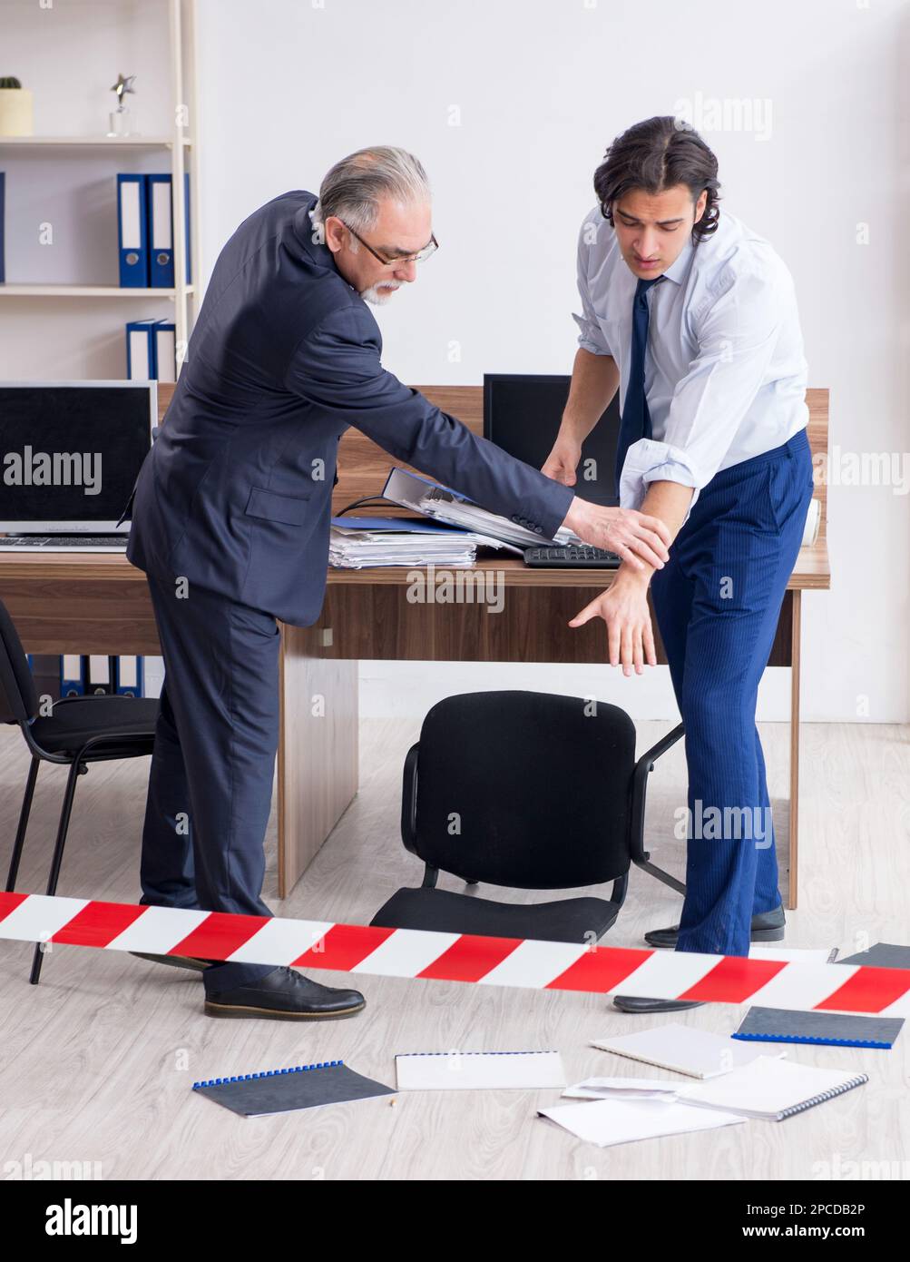 Detective investigating crime in office hi-res stock photography and ...