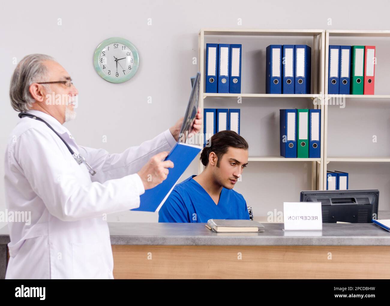 Doctors talking at the reception in hospital Stock Photo - Alamy