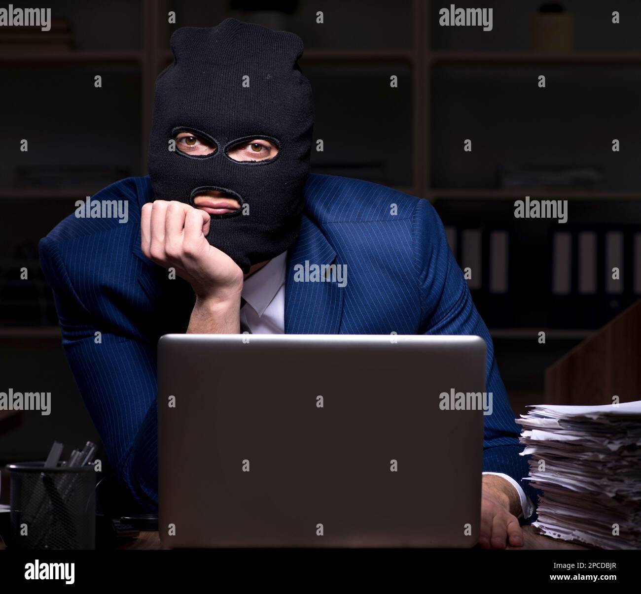 The male employee stealing information in the office night time Stock ...