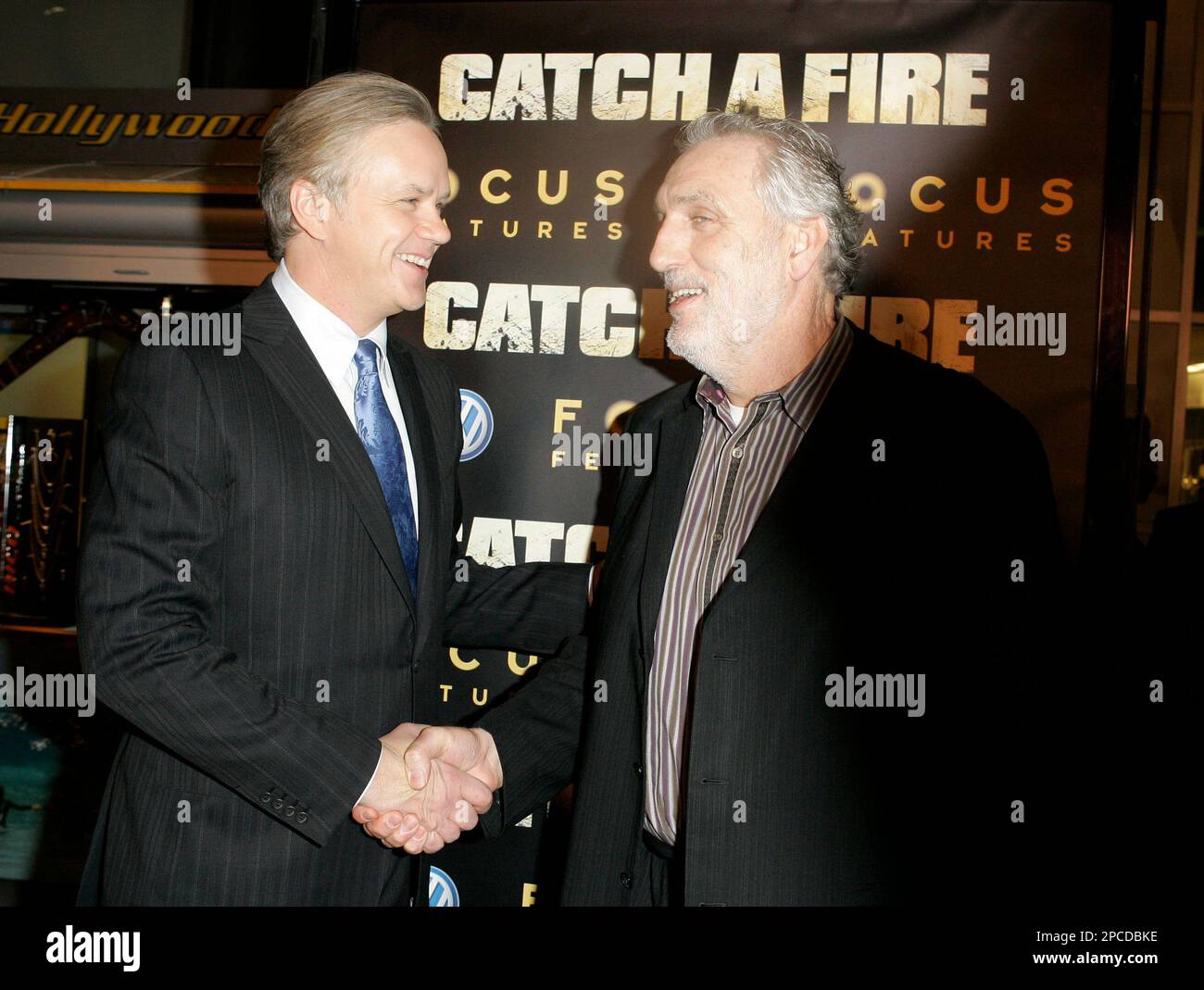 Actor Tim Robbins, left, greets director Phillip Noyce at the Los ...