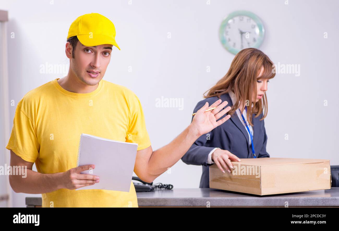 Male receptionist receiving payment hi-res stock photography and images ...
