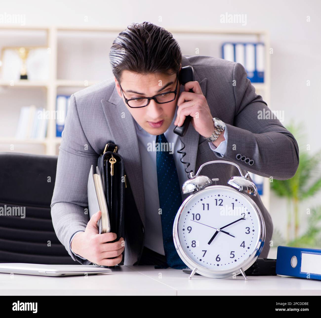 The businessman rushing in the office Stock Photo - Alamy