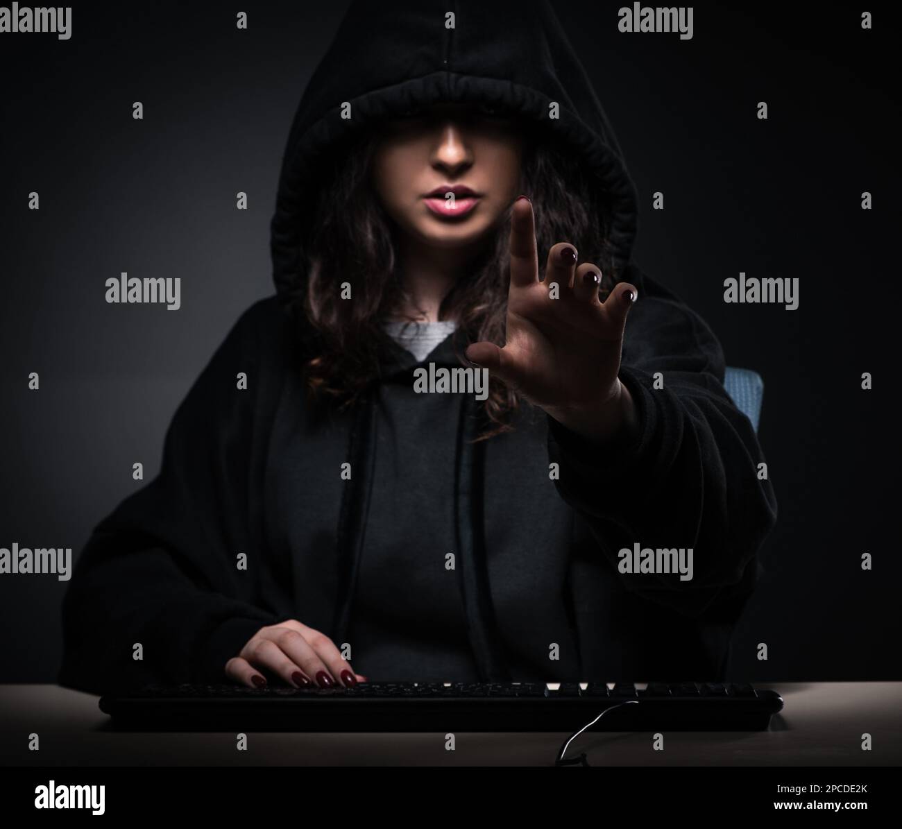 The female hacker hacking security firewall late in office Stock Photo ...