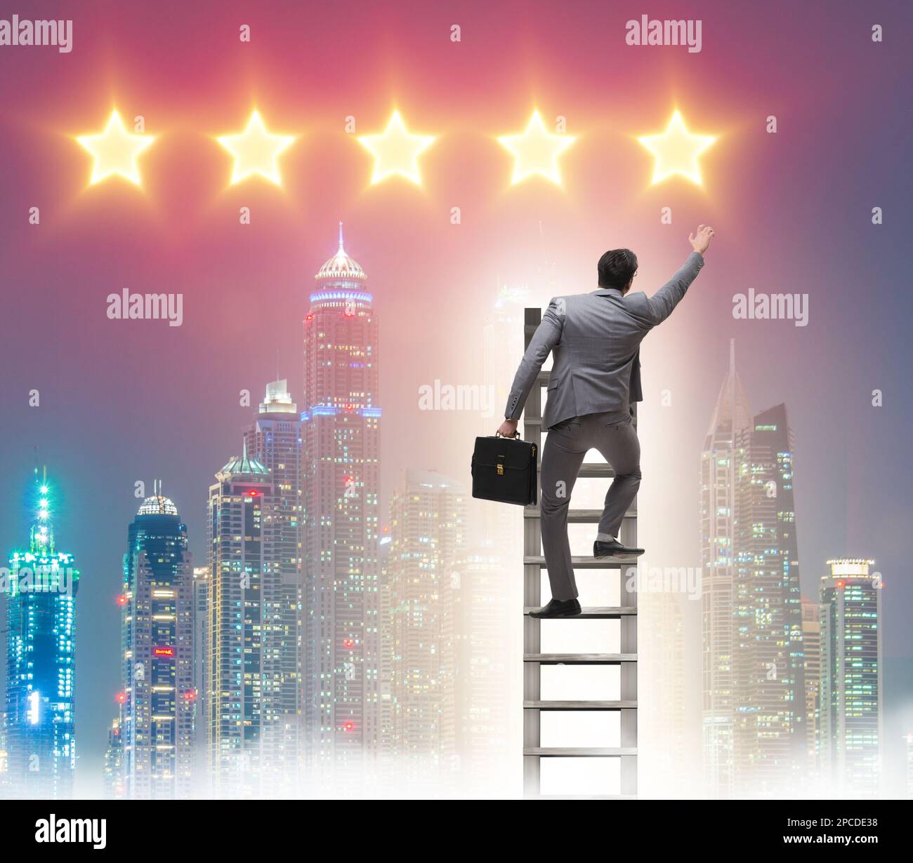 The businessman reaching out for stars Stock Photo - Alamy