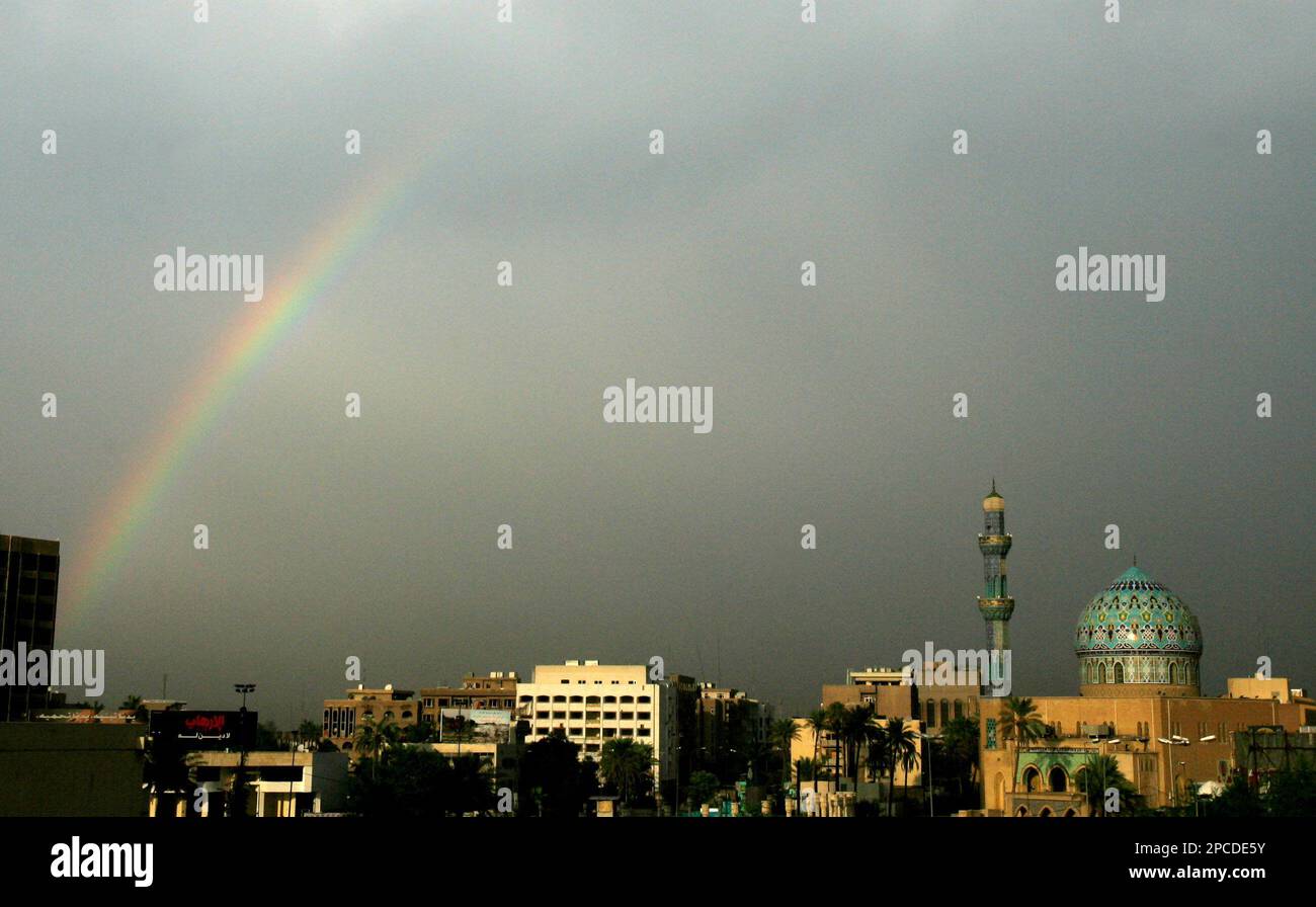 Rainbow raises over the 14th of Ramadan Mosque in central Baghdad, Iraq ...