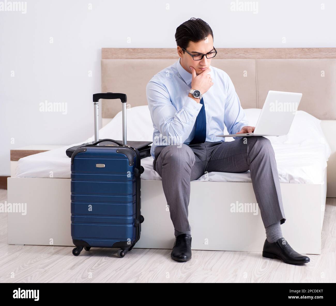 The businessman working in hotel room Stock Photo - Alamy