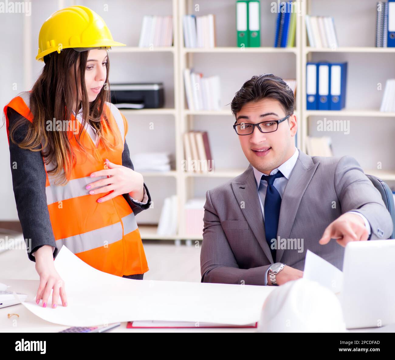 The construction foreman supervisor reviewing drawings Stock Photo - Alamy
