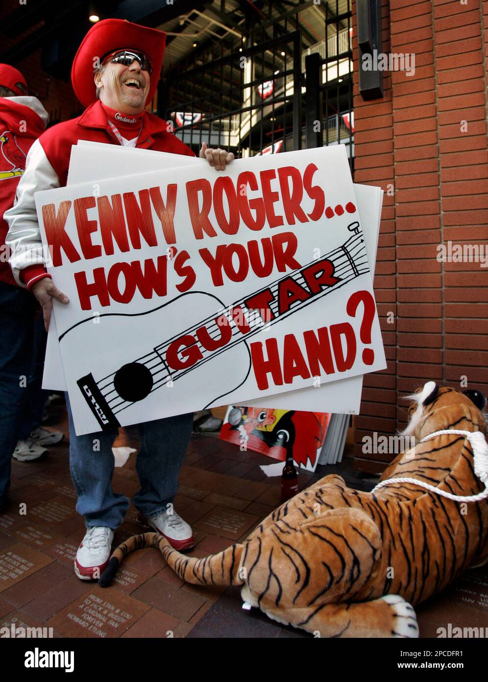 Marty Prather, from Sprinfield, Mo., displays some of the signs he's ...
