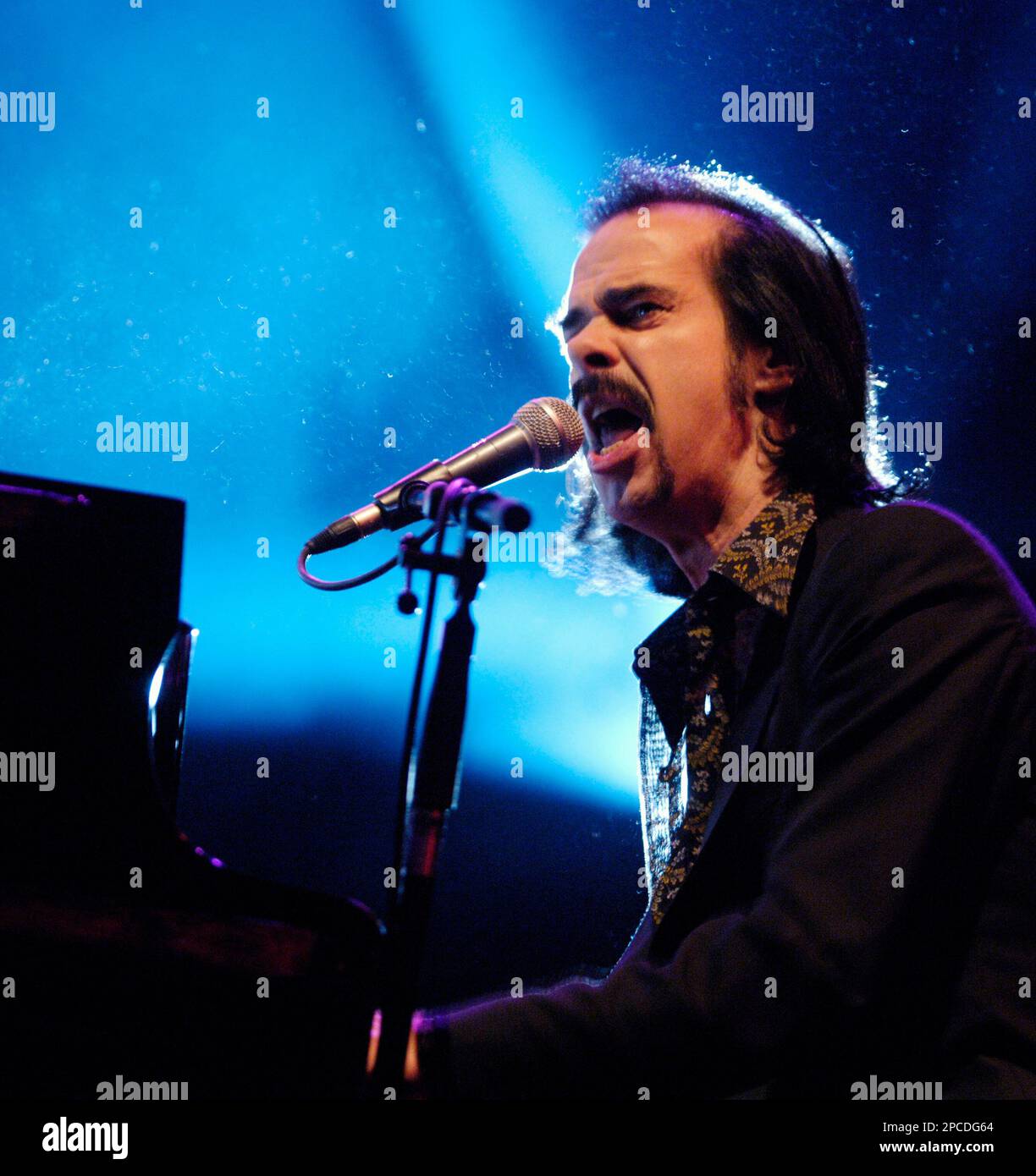 Australian singer Nick Cave offers original grisly tunes as well as old ...