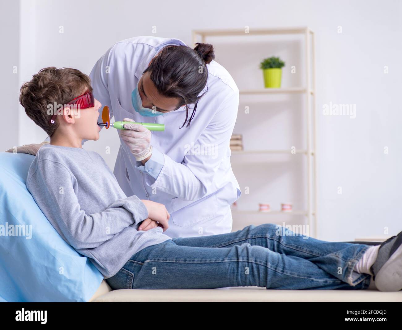 The young boy visiting doctor in hospital Stock Photo - Alamy