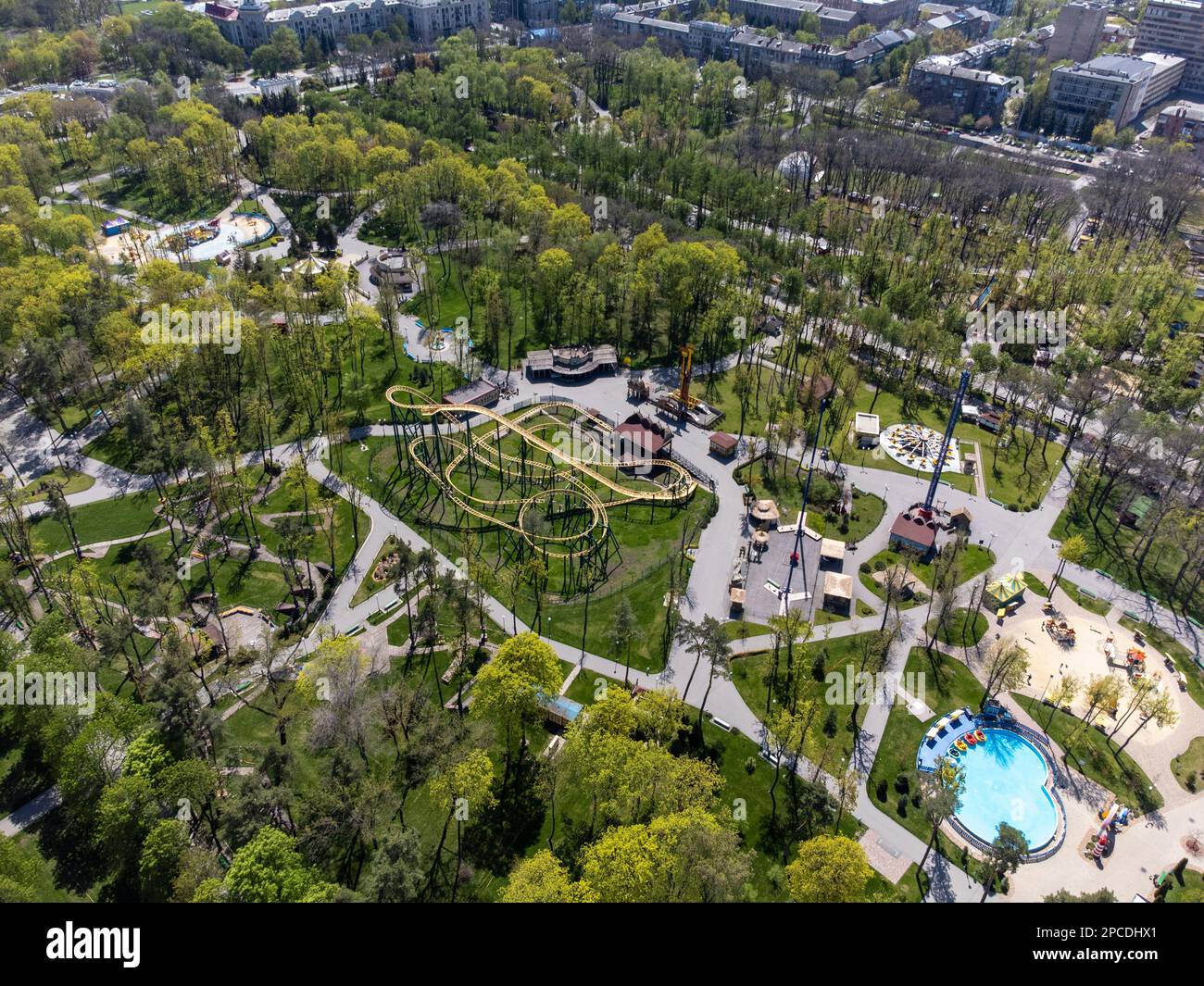Attractions and playgrounds in spring greenery. Aerial look down view ...