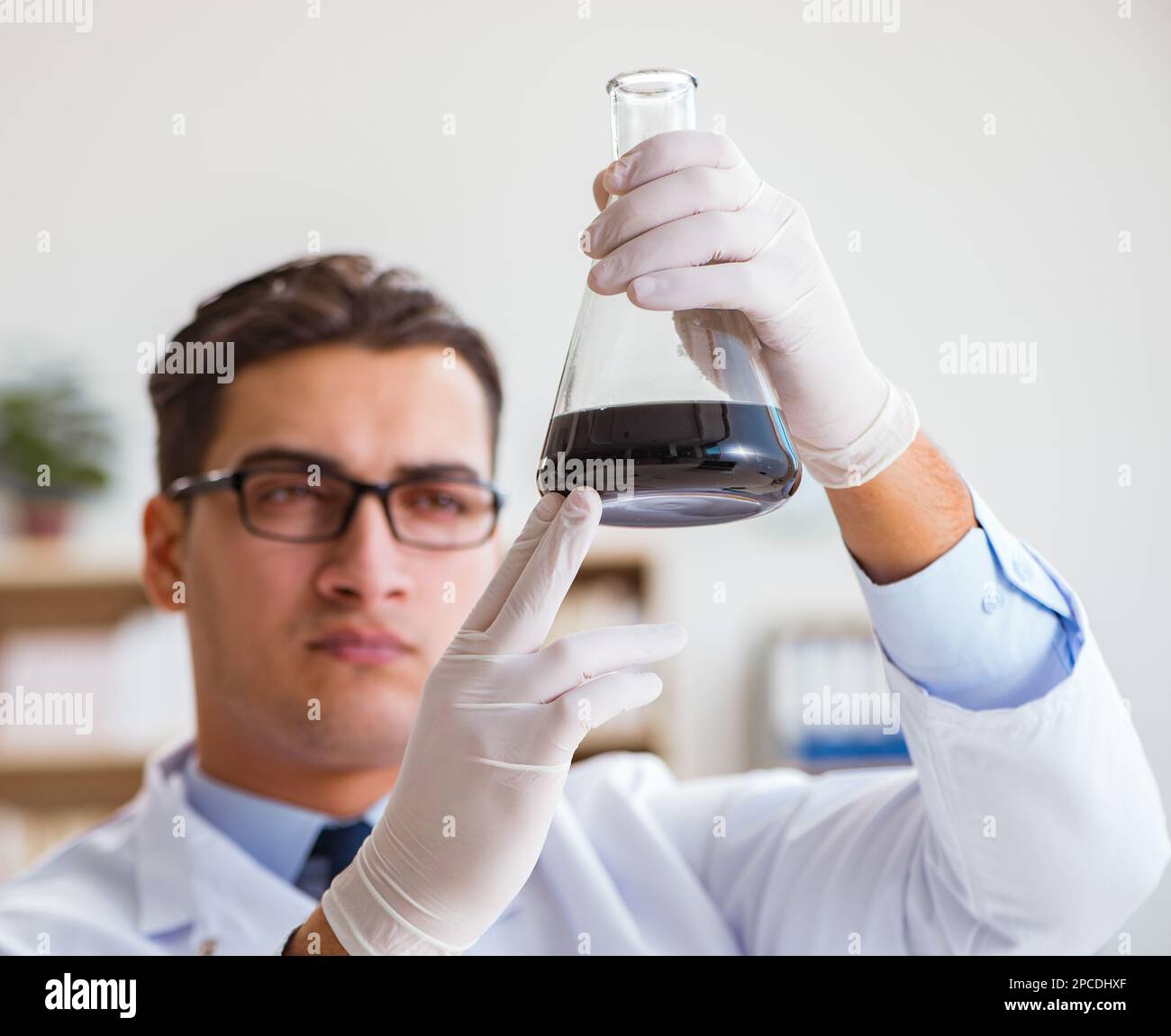 The chemical engineer working on oil samples in lab Stock Photo - Alamy