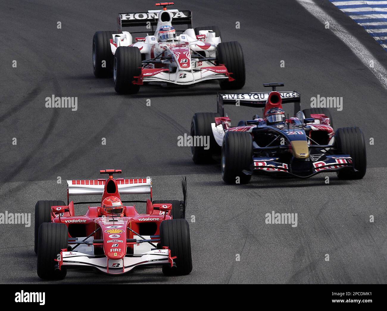 Germany's Michael Schumacher, front left, drives his Ferrari with a ...