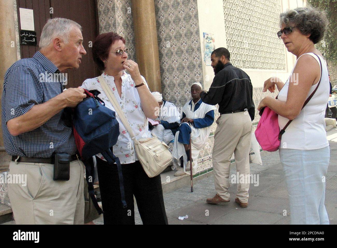 Joelle Simon, right, and friend Annick Moseley, second left, stand ...