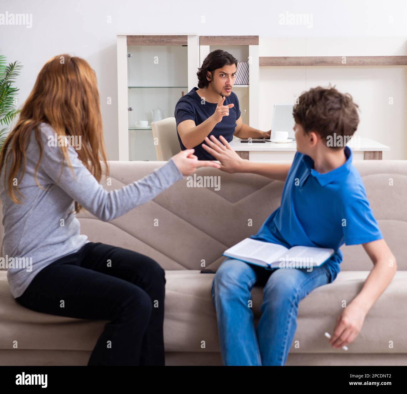 The concept of underage smoking with young boy and family Stock Photo ...