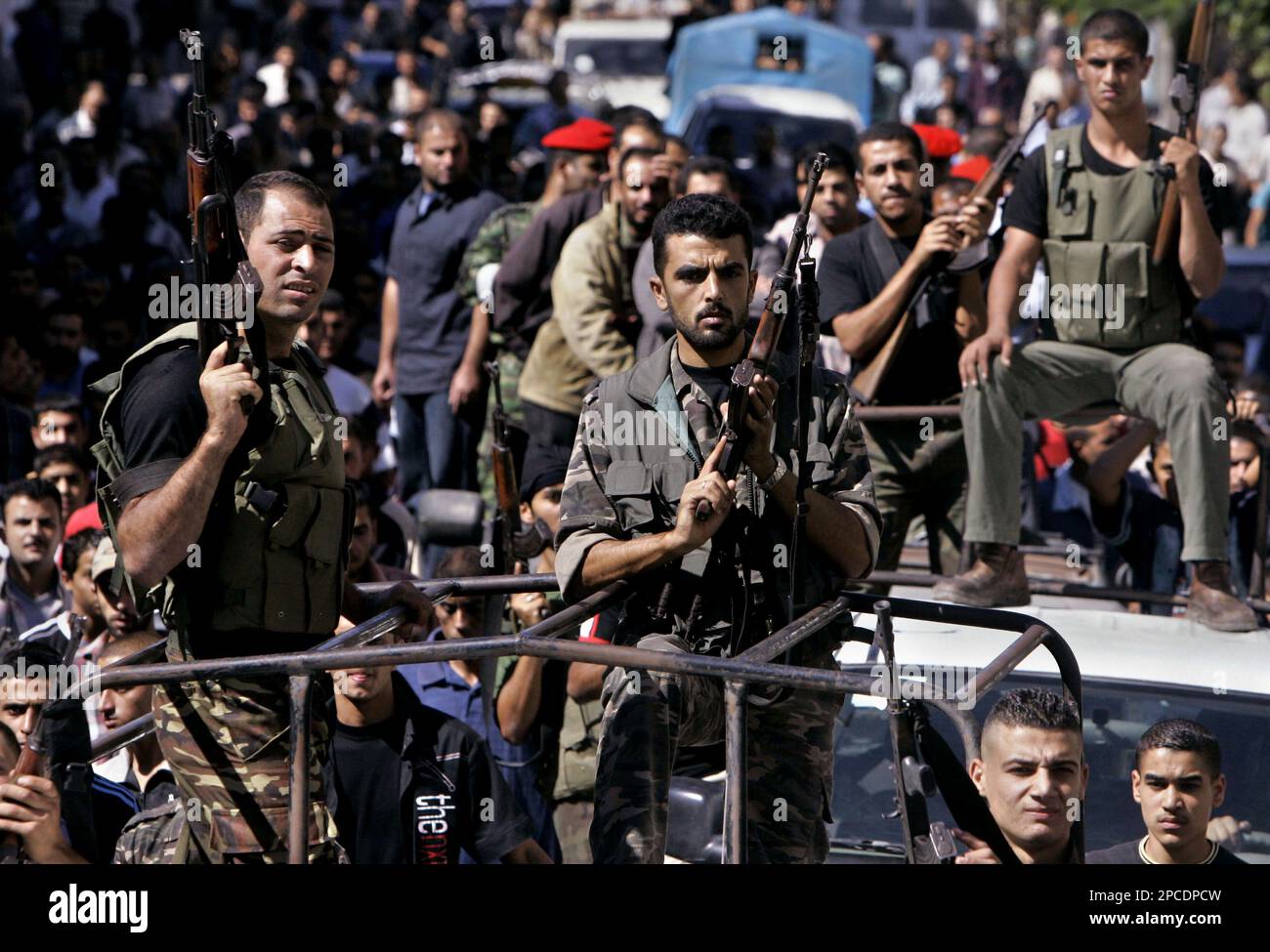 Palestinian security force officers carry their weapons during the ...