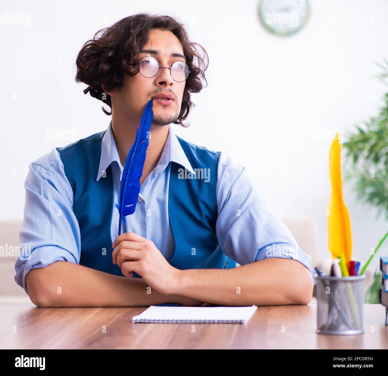 The young writer working on his new work Stock Photo - Alamy