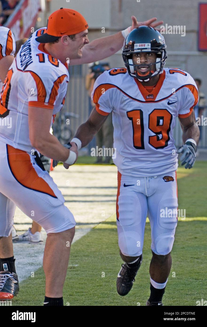 Oregon State's Sammie Stroughter (18) is congratulated by teammate Ryan ...